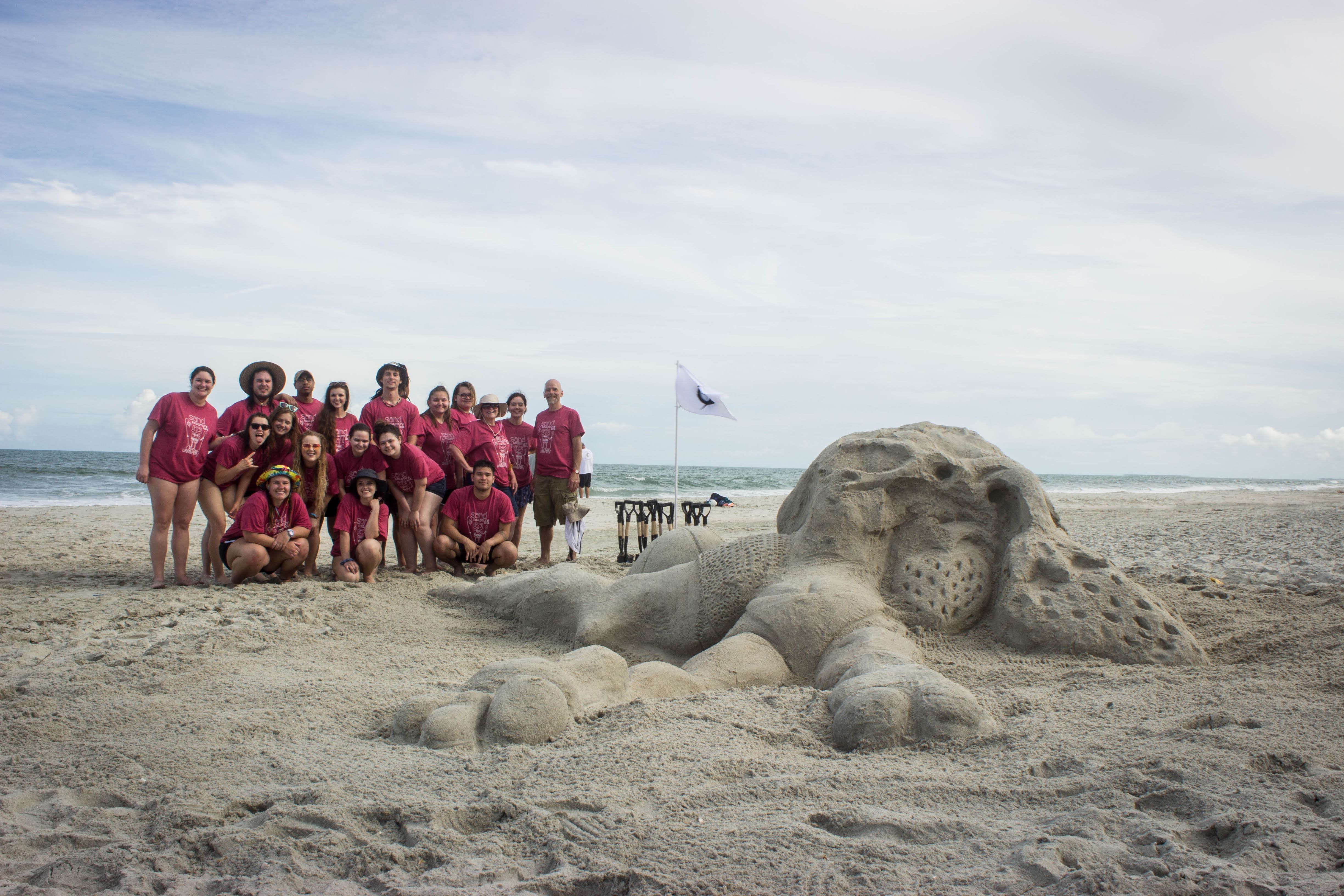 College visual arts students form elaborate sand sculptures on Grand ...